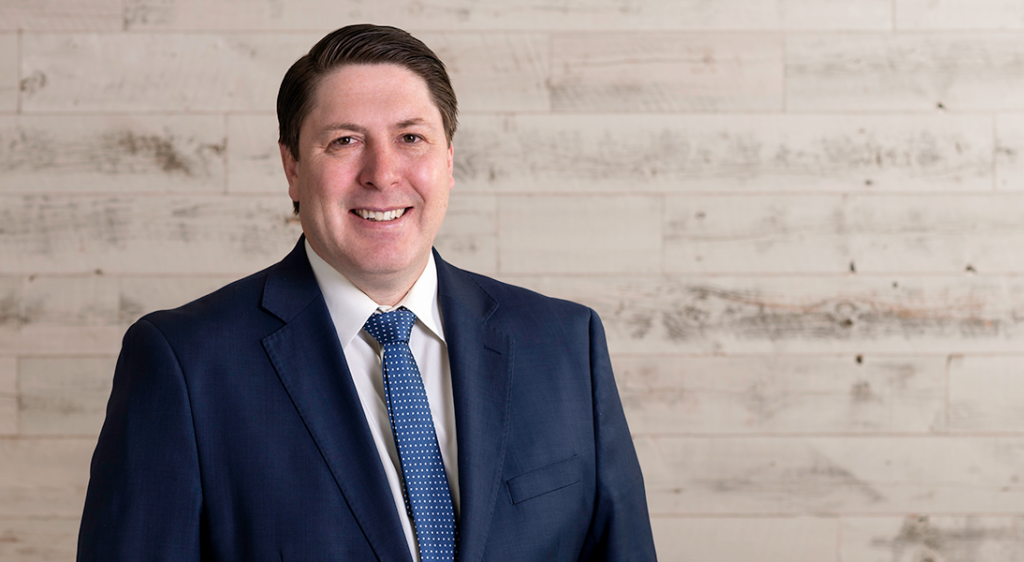 R. John Wells – Larson • King, LLP
